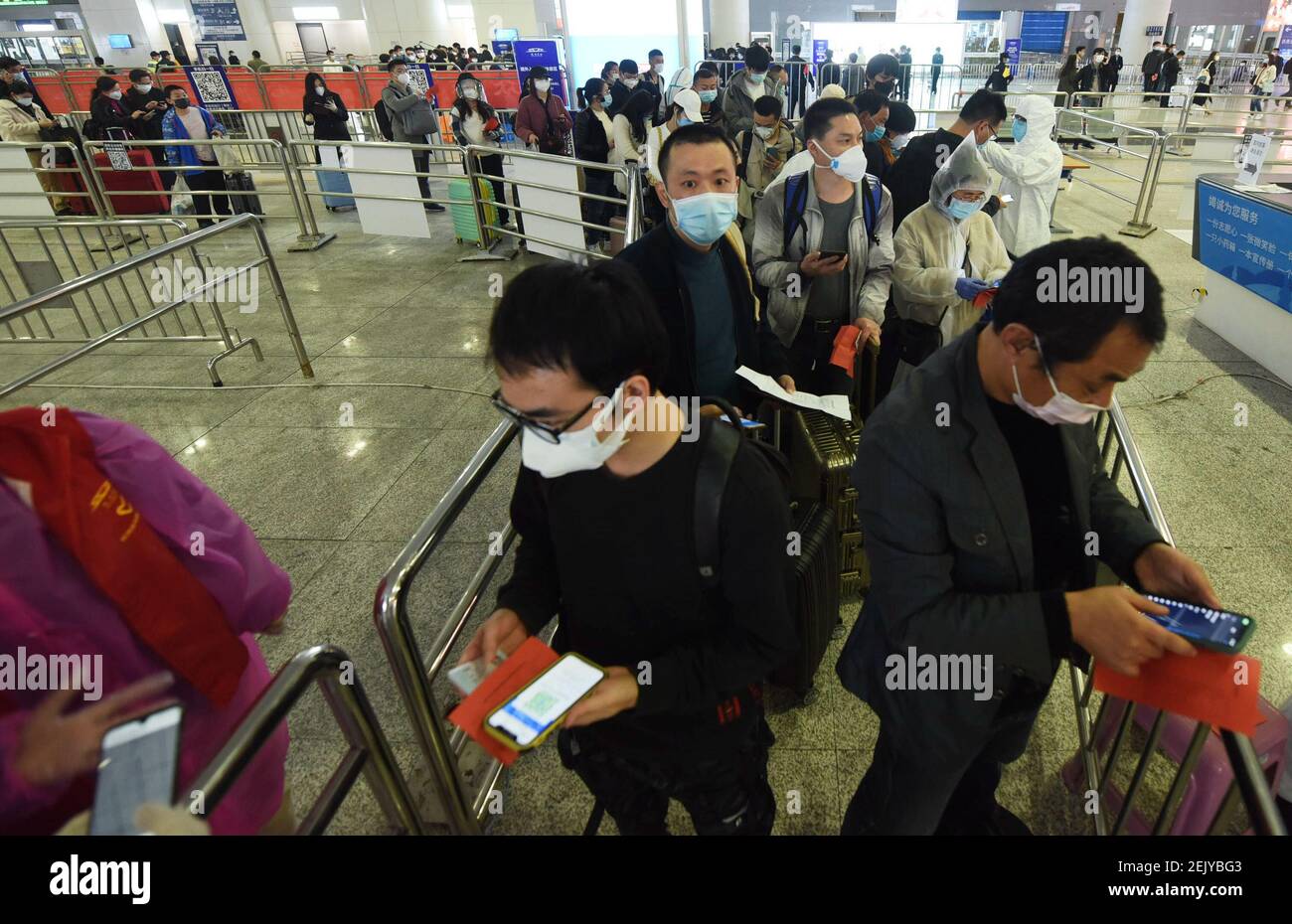 HANGZHOU, CHINA - APRIL 8, 2020 - Passengers pass the health code and ...