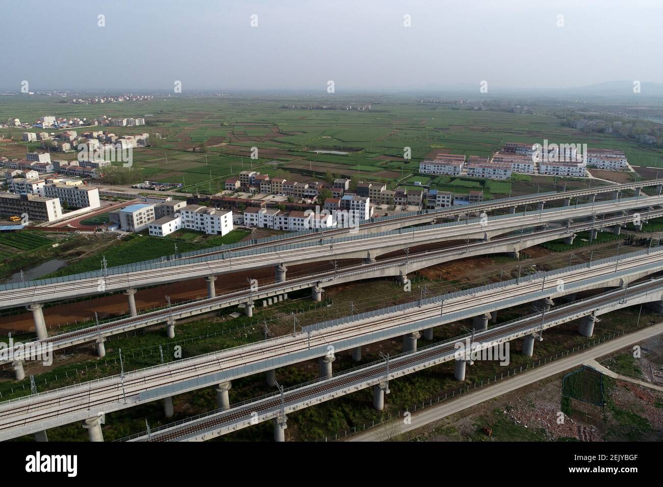 An aerial view of flyover of railway extending to the horizon line ...