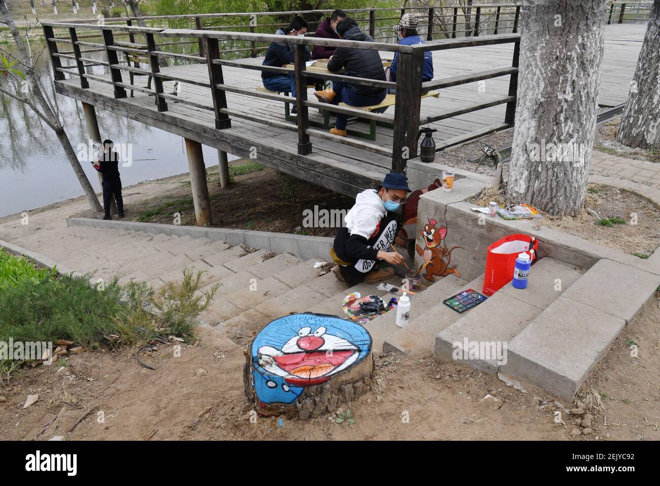 The artist Mr. Wu is painting on a staircase near Yueliang Castle Moon ...