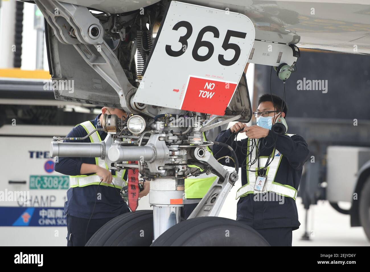 Aircraft ground handling staff work to serve the cargo aircrafts ...