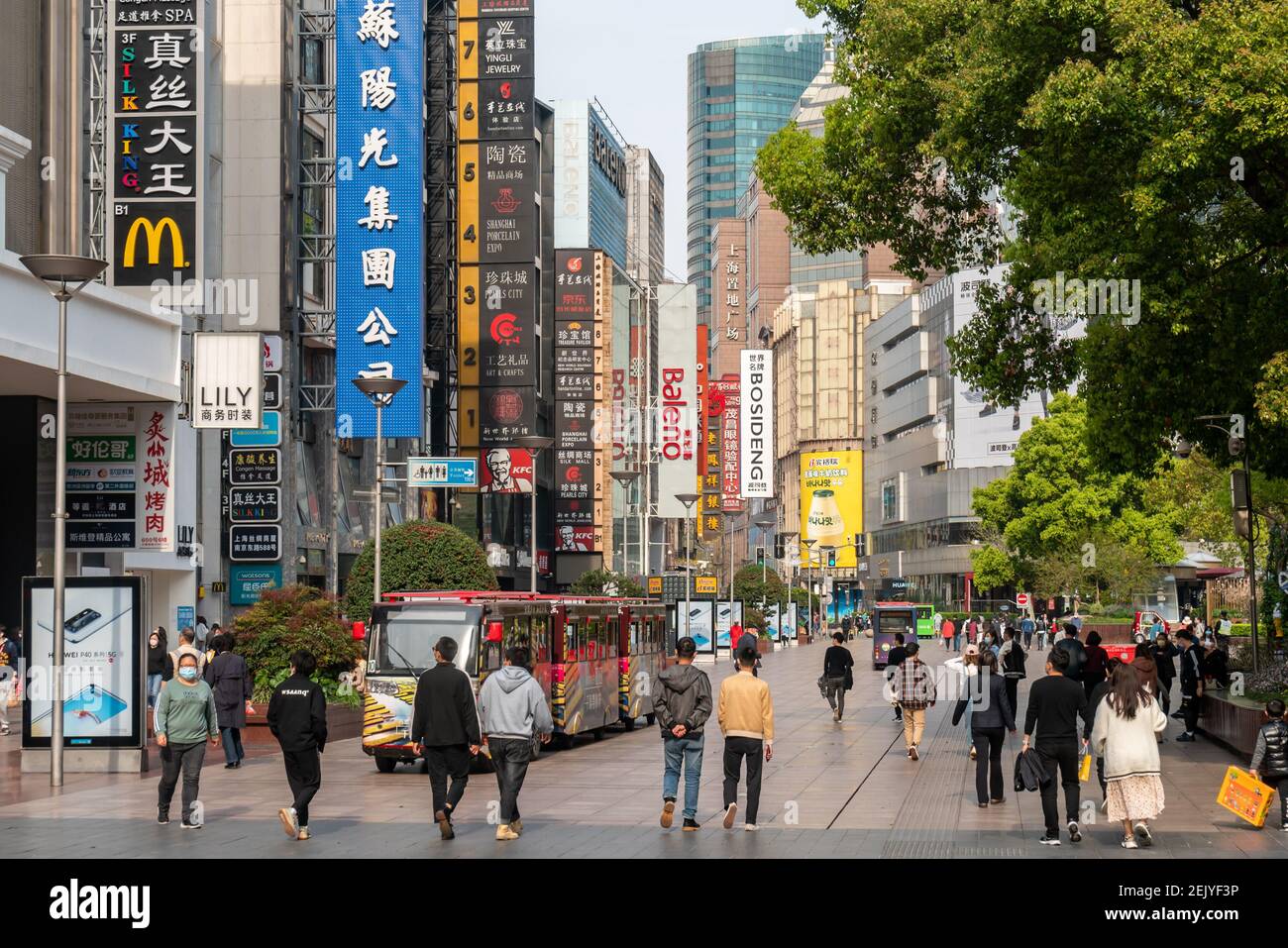 SHANGHAI, CHINA - APRIL 8, 2020 - Pedestrians shopping in front of ...