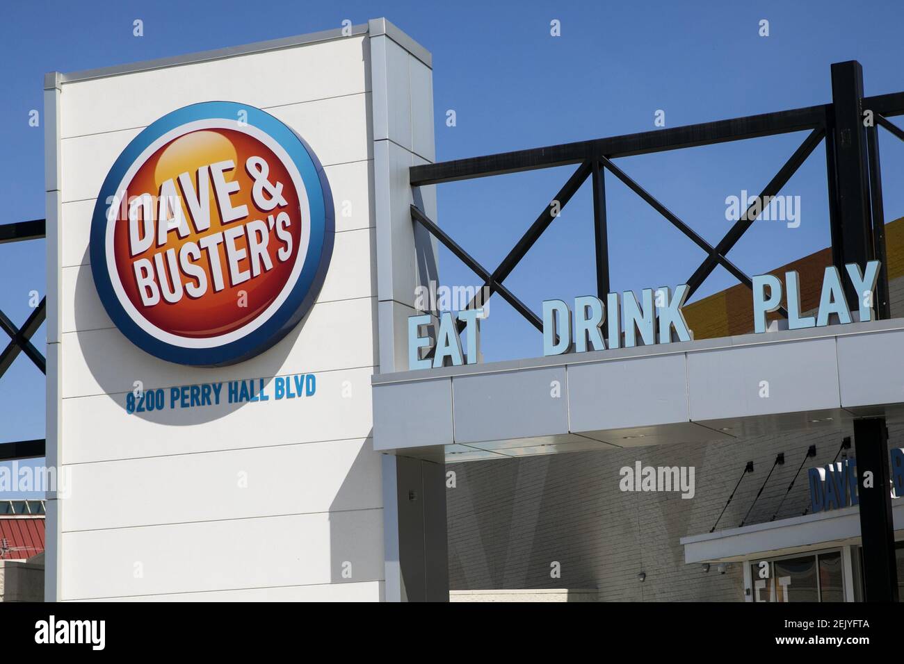 A logo sign outside of a Dave & Buster's location in Baltimore ...