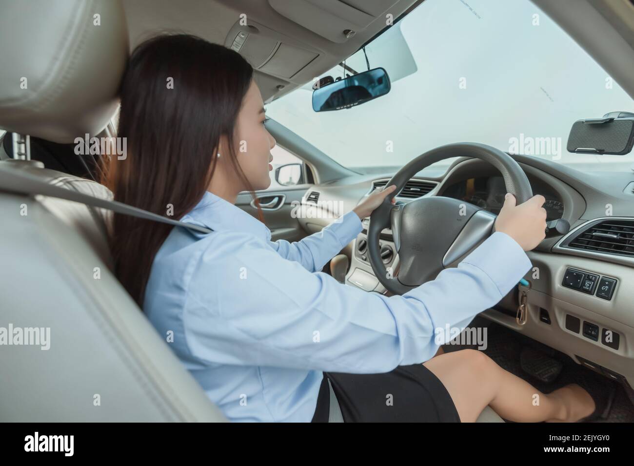 woman use mobile phone while driving a car Stock Photo - Alamy
