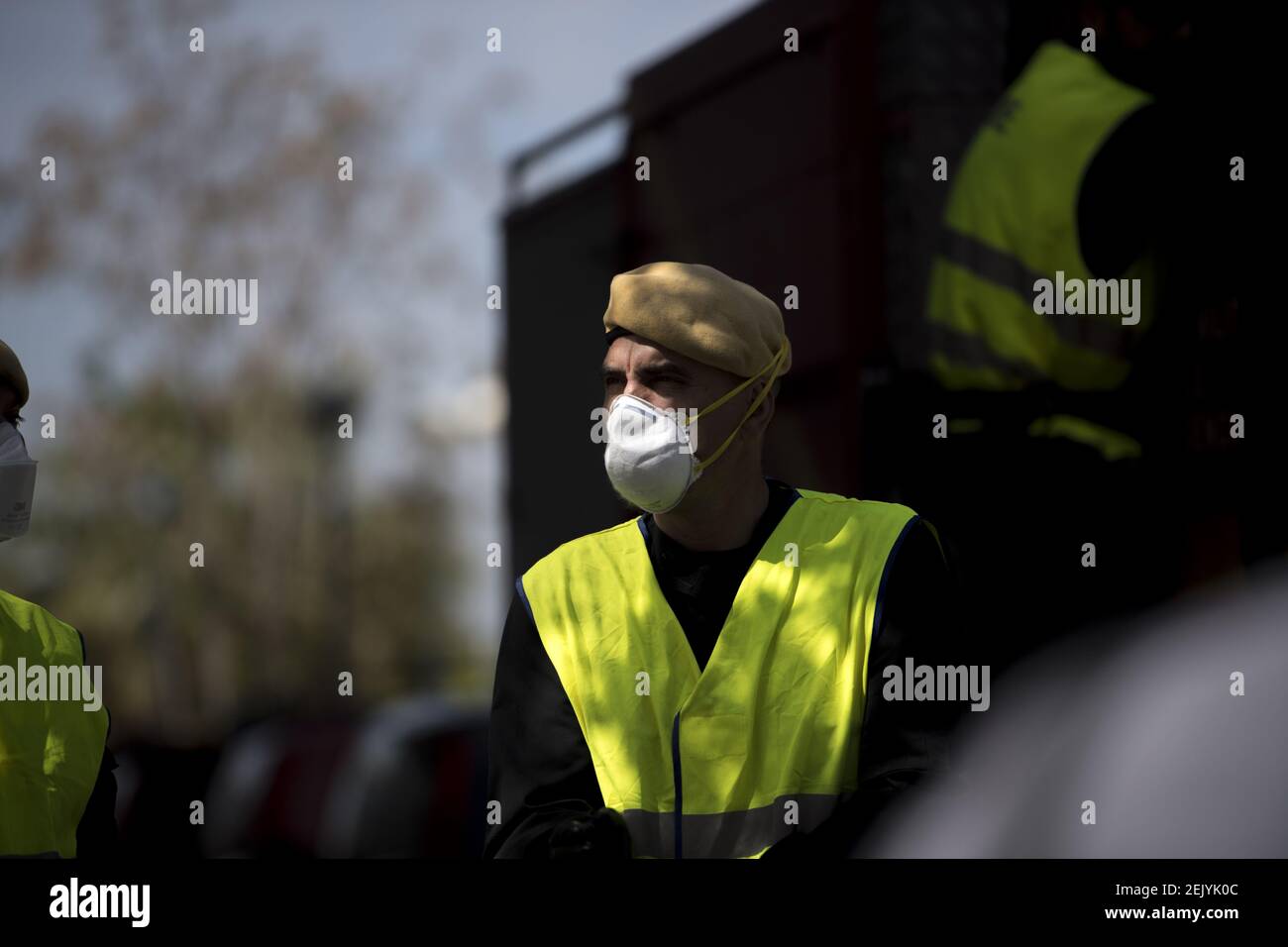 A member of the UME wearing a face mask as a preventive measure during ...