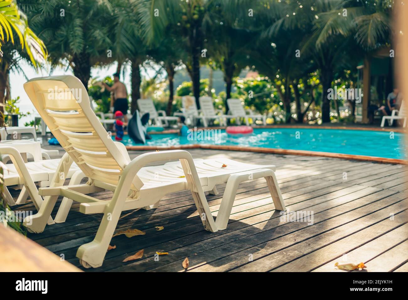Lounge chairs near the pool at the hotel Stock Photo - Alamy