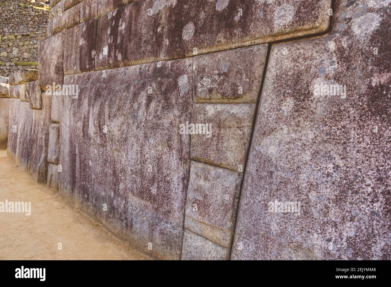 A close up of a inca stone wall from Machu Picchu temple Stock Photo ...