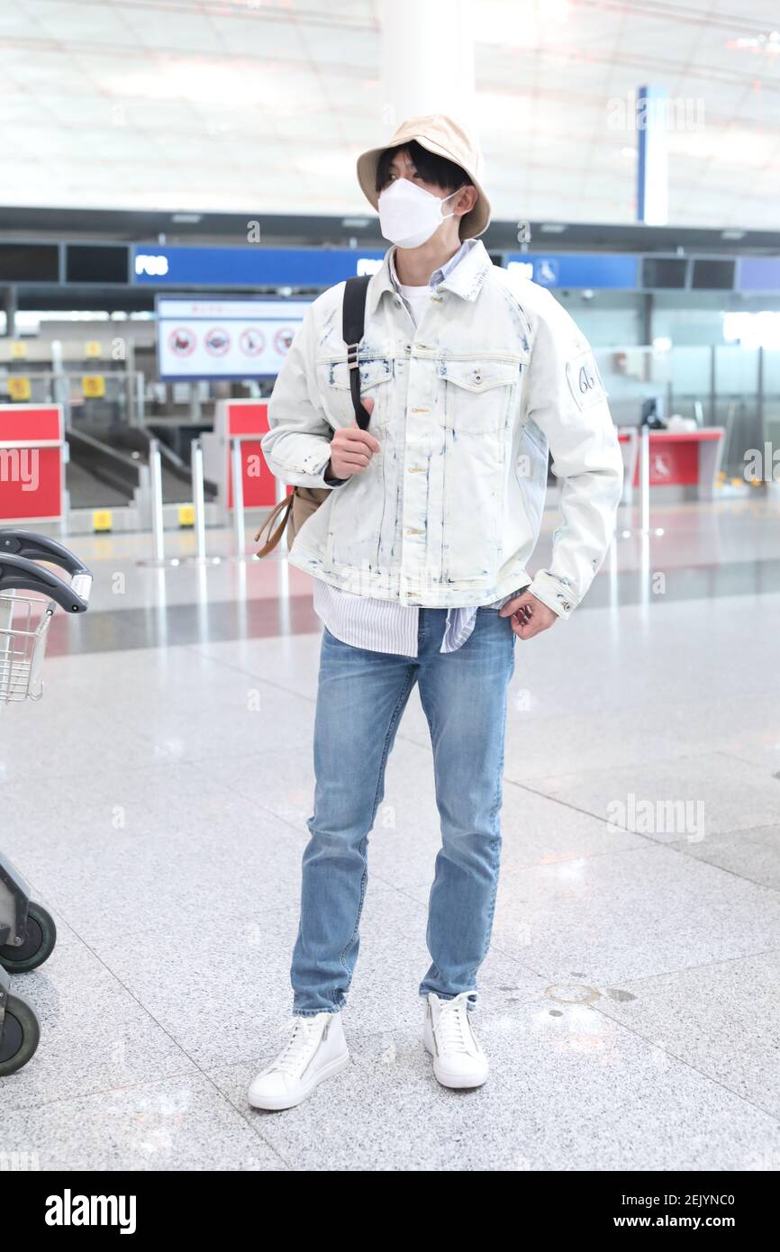 Chinese actor Zhang Yunlong arrives at a Beijing airport before ...