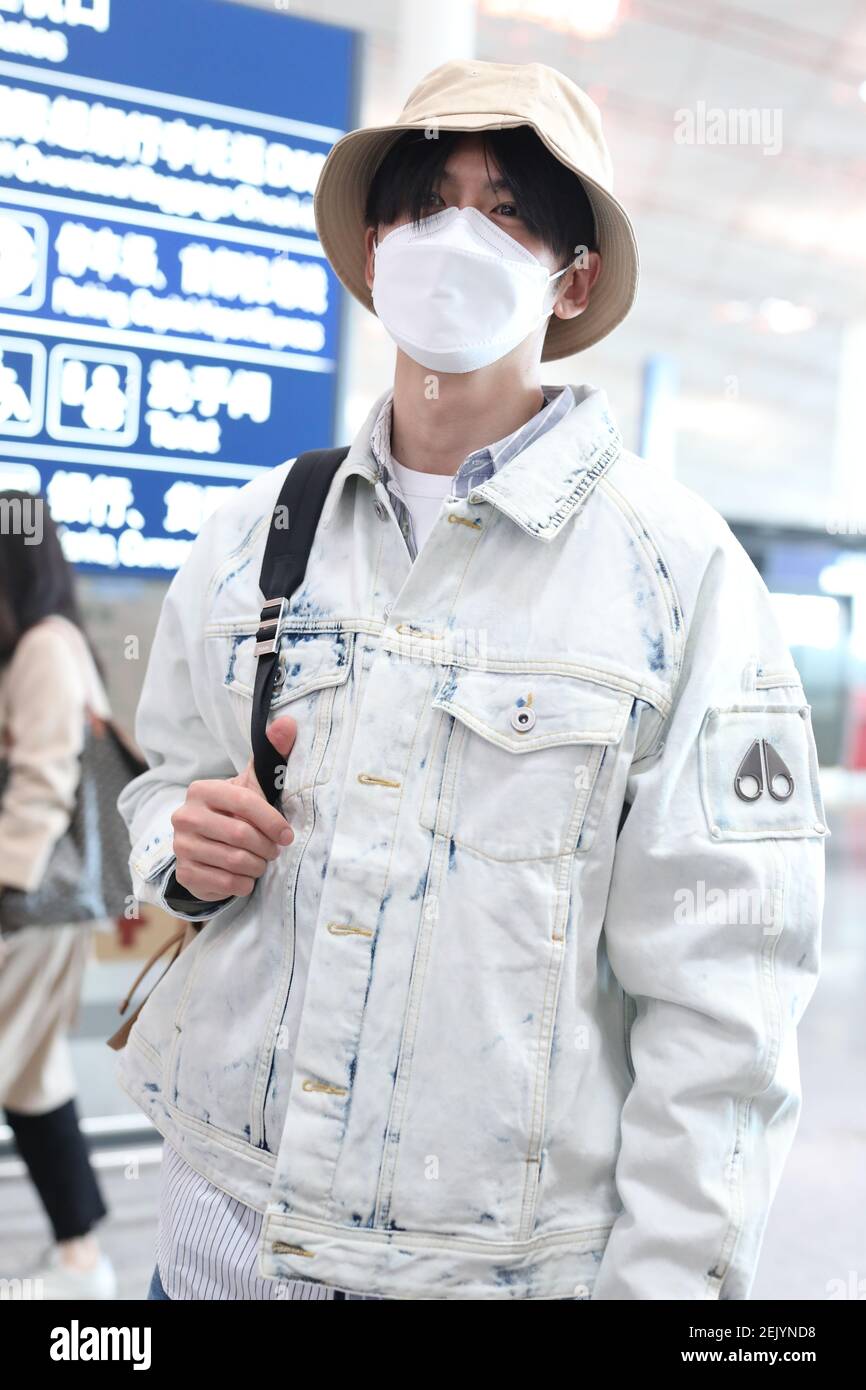 Chinese actor Zhang Yunlong arrives at a Beijing airport before ...
