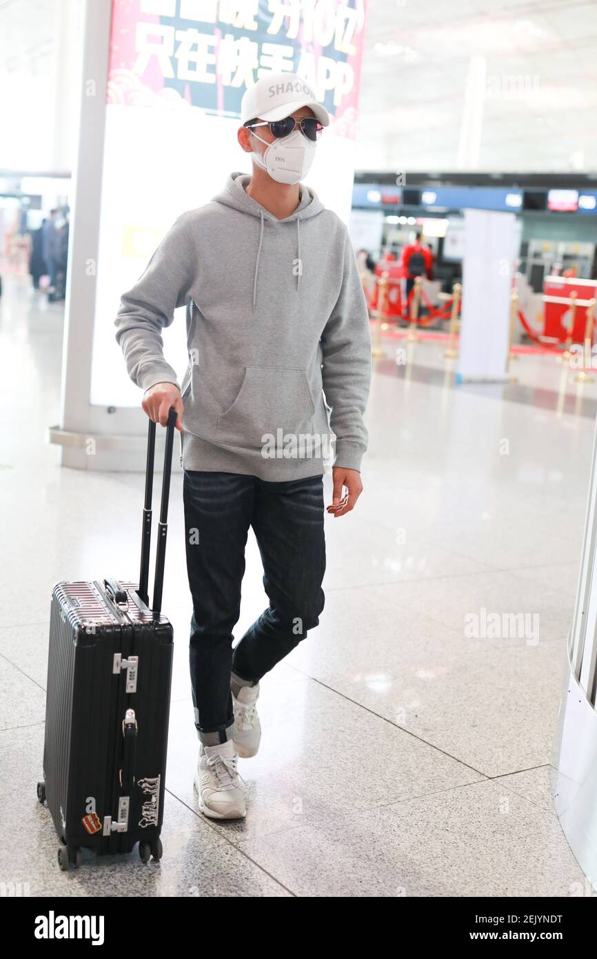 Chinese actor Qiao Zhenyu arrives at a Beijing airport before departure in Beijing, China, 12 ...