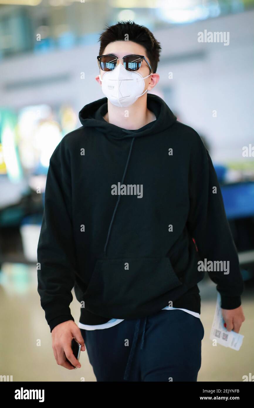 Chinese actor and singer Jin Han arrives at a Shanghai airport before ...