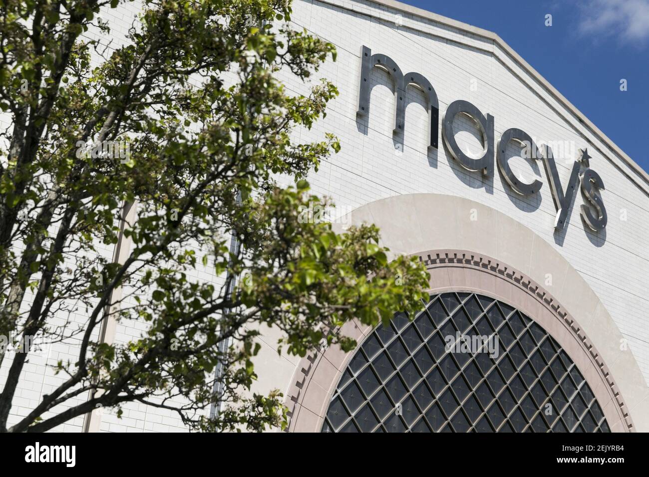 A logo sign outside of a Macy's retail store location in Mays Landing ...