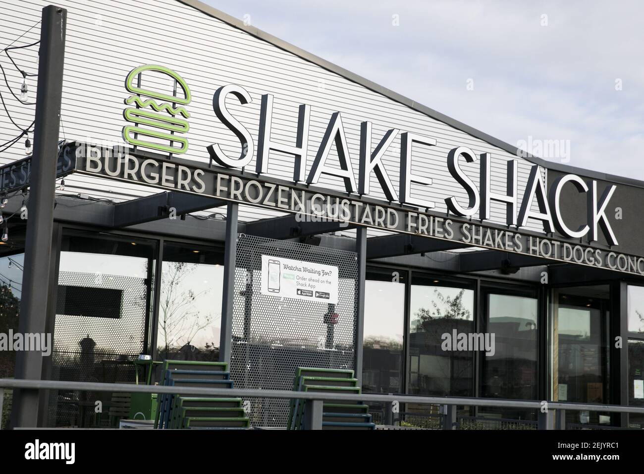 A logo sign outside of a Shake Shack restaurant location in Newark ...