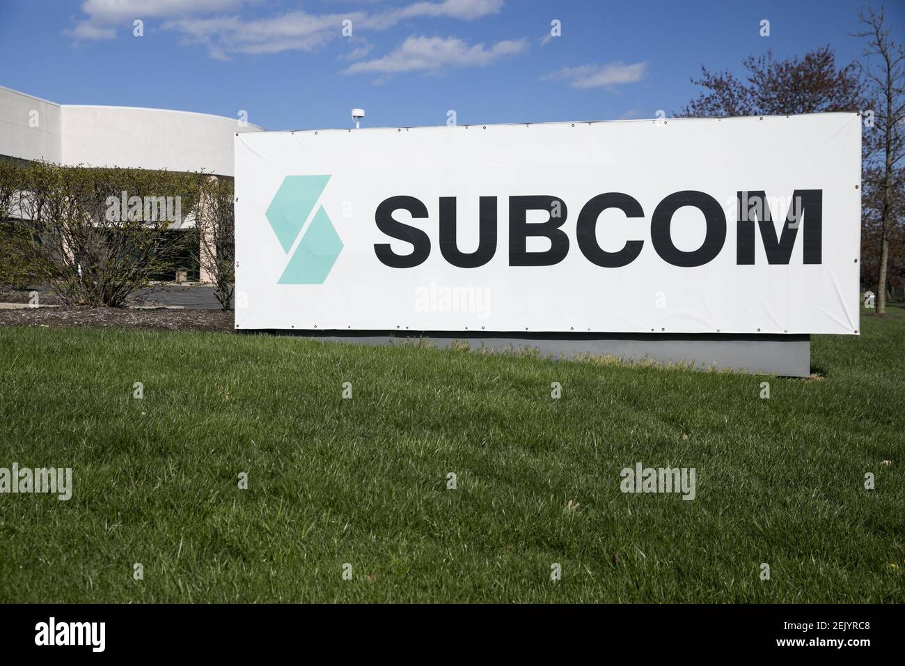 A logo sign outside of a facility occupied by SubCom in Eatontown, New ...