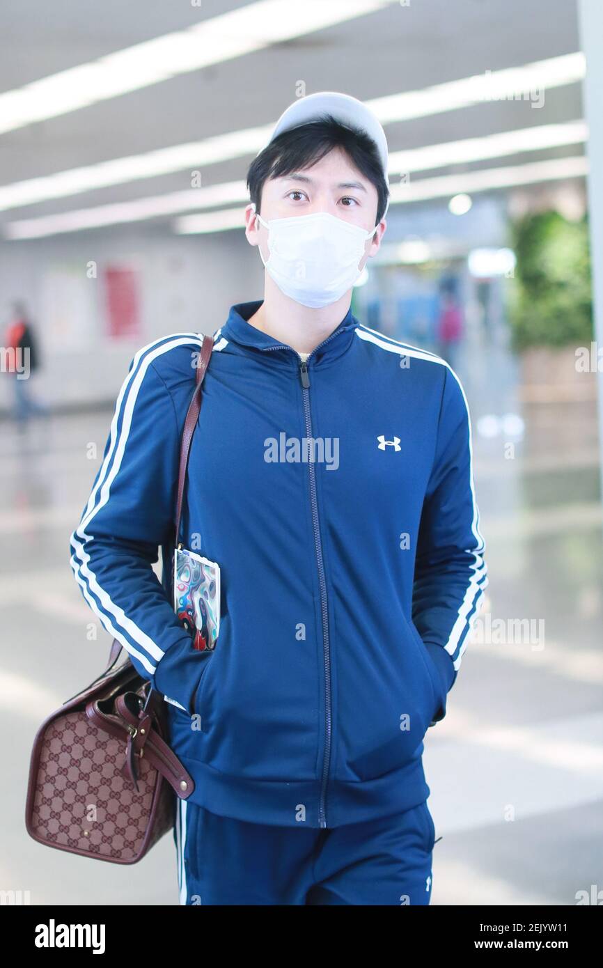 Chinese actor Mao Zijun arrives at a Beijing airport before departure ...