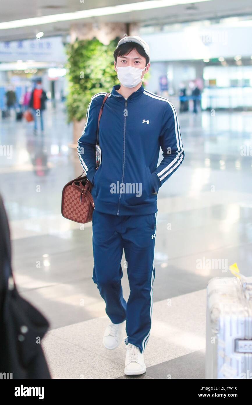 Chinese actor Mao Zijun arrives at a Beijing airport before departure ...