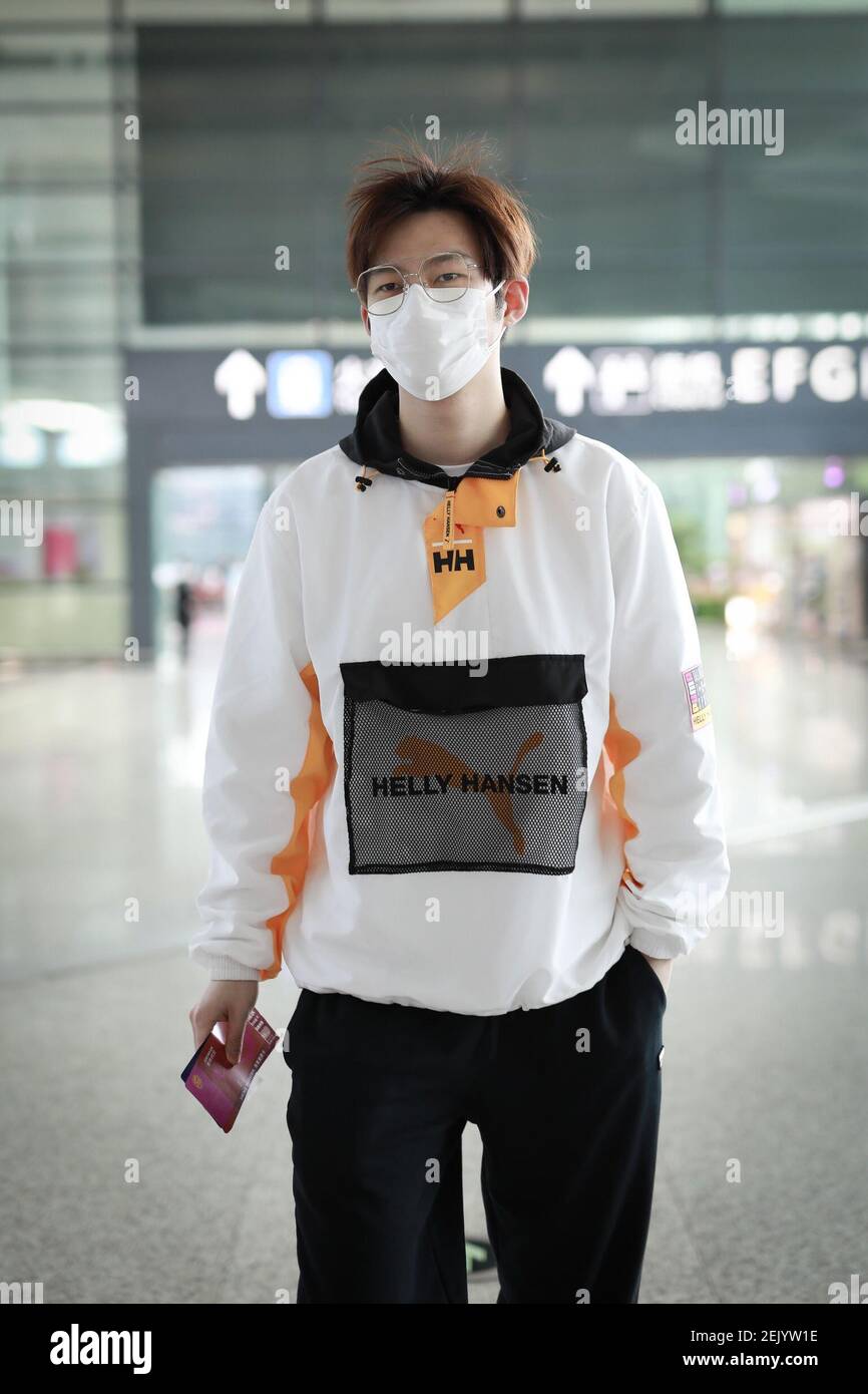 Chinese singer and actor Dong Li arrives at a Shanghai airport before ...