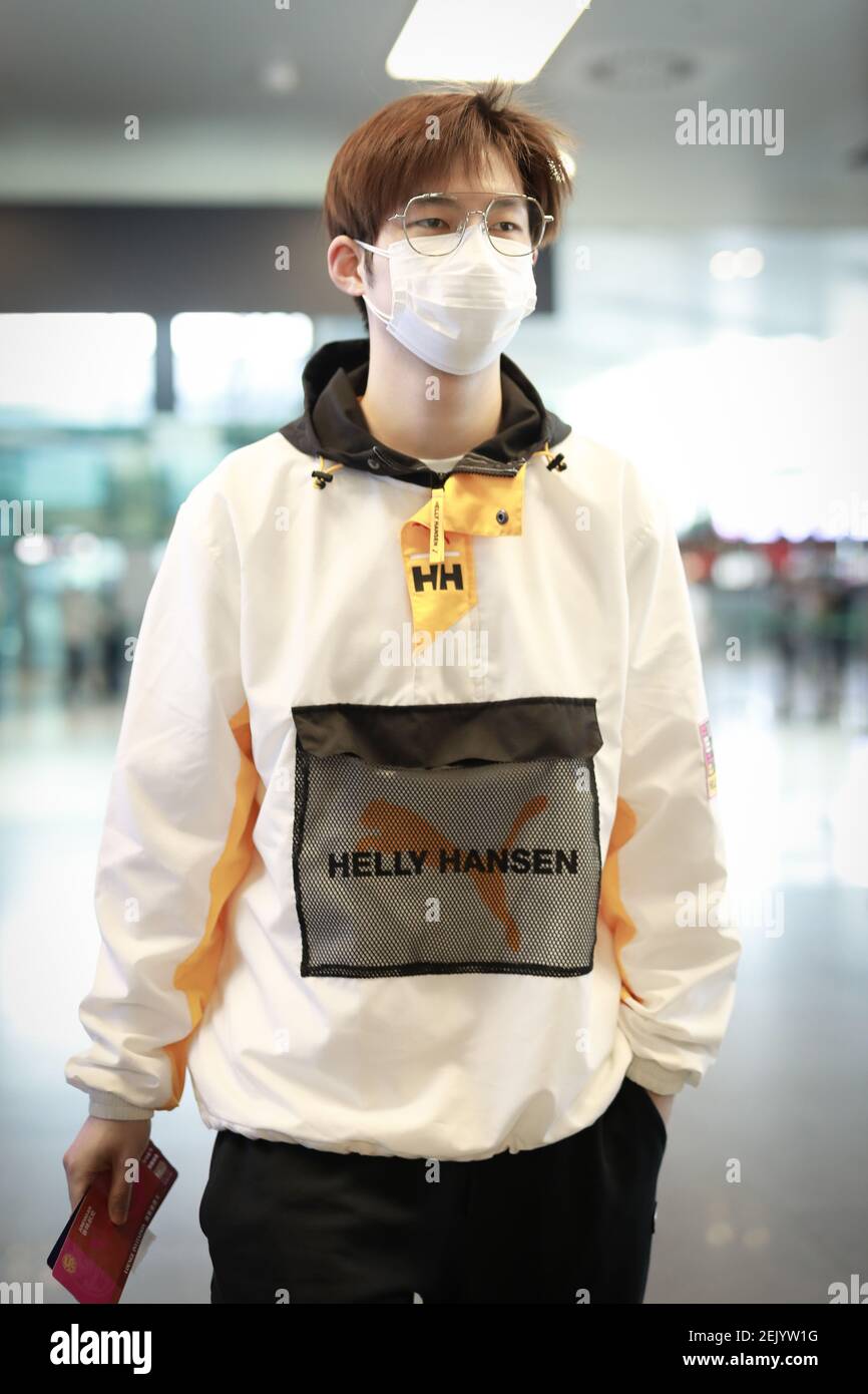 Chinese singer and actor Dong Li arrives at a Shanghai airport before ...