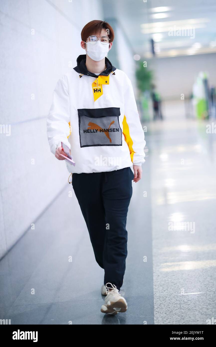 Chinese singer and actor Dong Li arrives at a Shanghai airport before ...