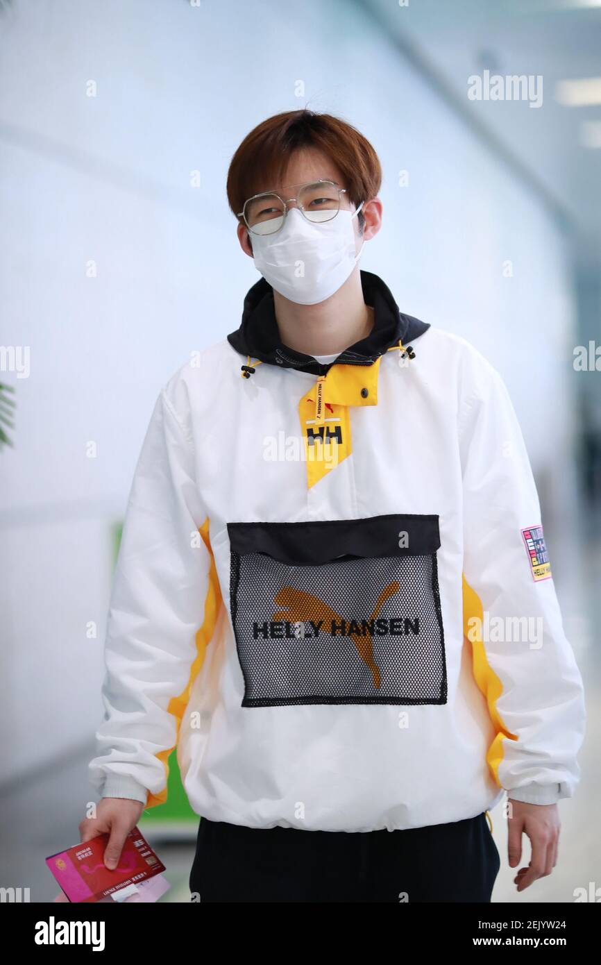 Chinese singer and actor Dong Li arrives at a Shanghai airport before ...