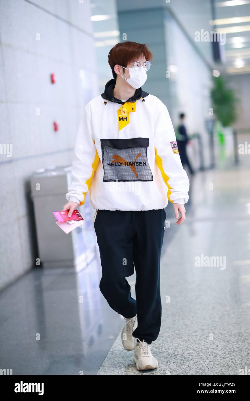 Chinese singer and actor Dong Li arrives at a Shanghai airport before ...