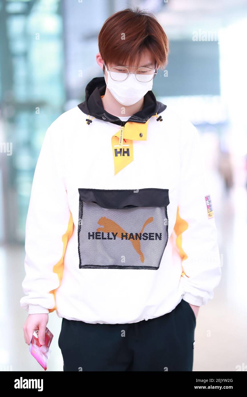 Chinese singer and actor Dong Li arrives at a Shanghai airport before ...