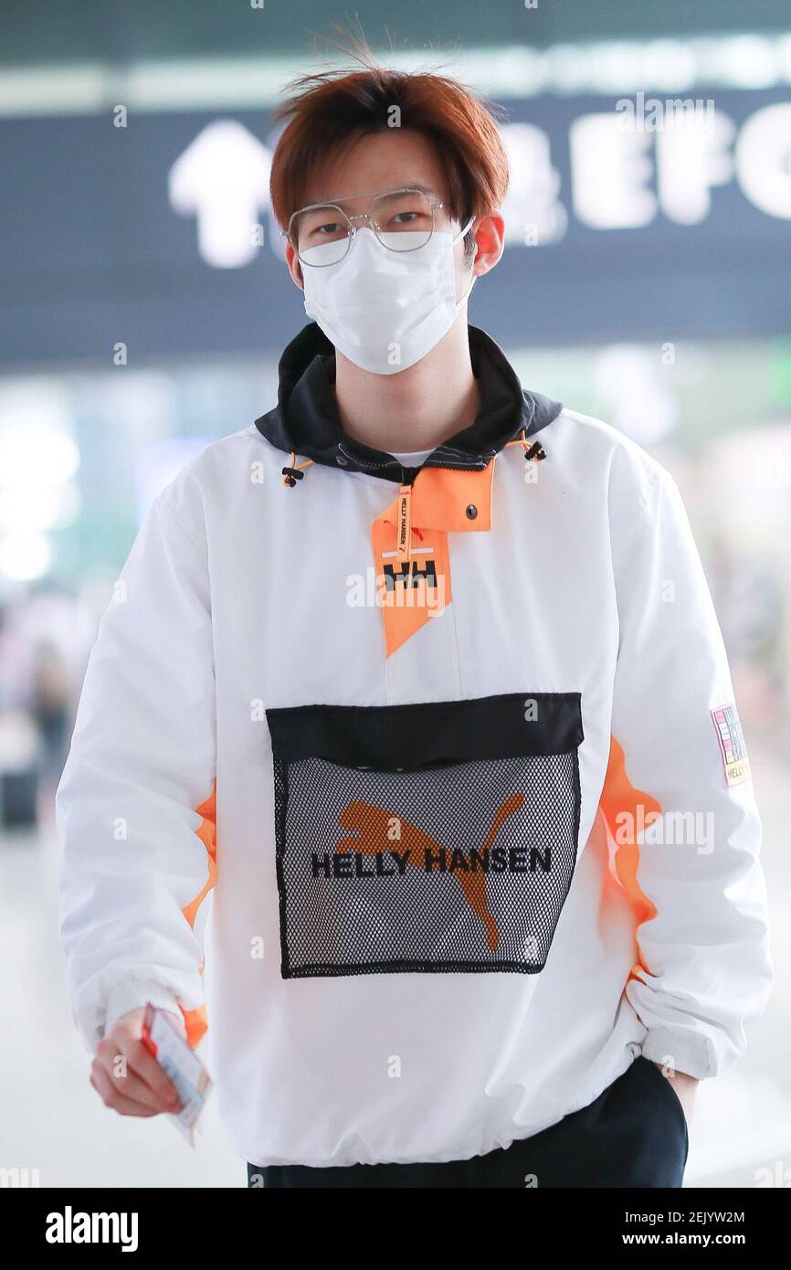 Chinese singer and actor Dong Li arrives at a Shanghai airport before ...