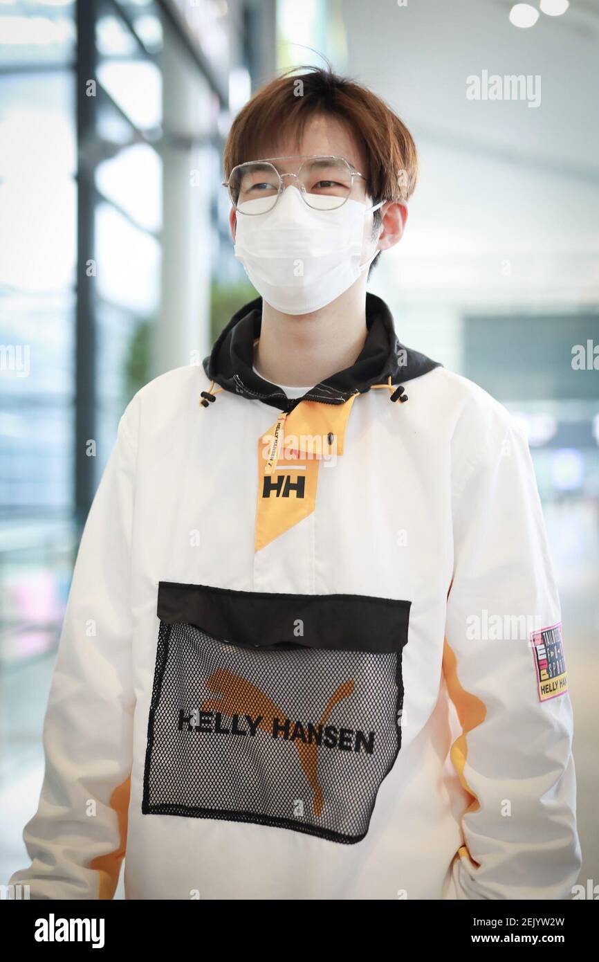 Chinese singer and actor Dong Li arrives at a Shanghai airport before ...