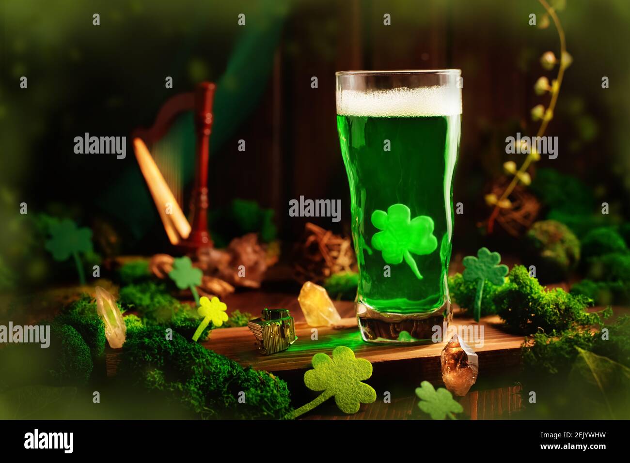 St. Patrick's Day Green Beer pint over wooden background, with shamrock ...