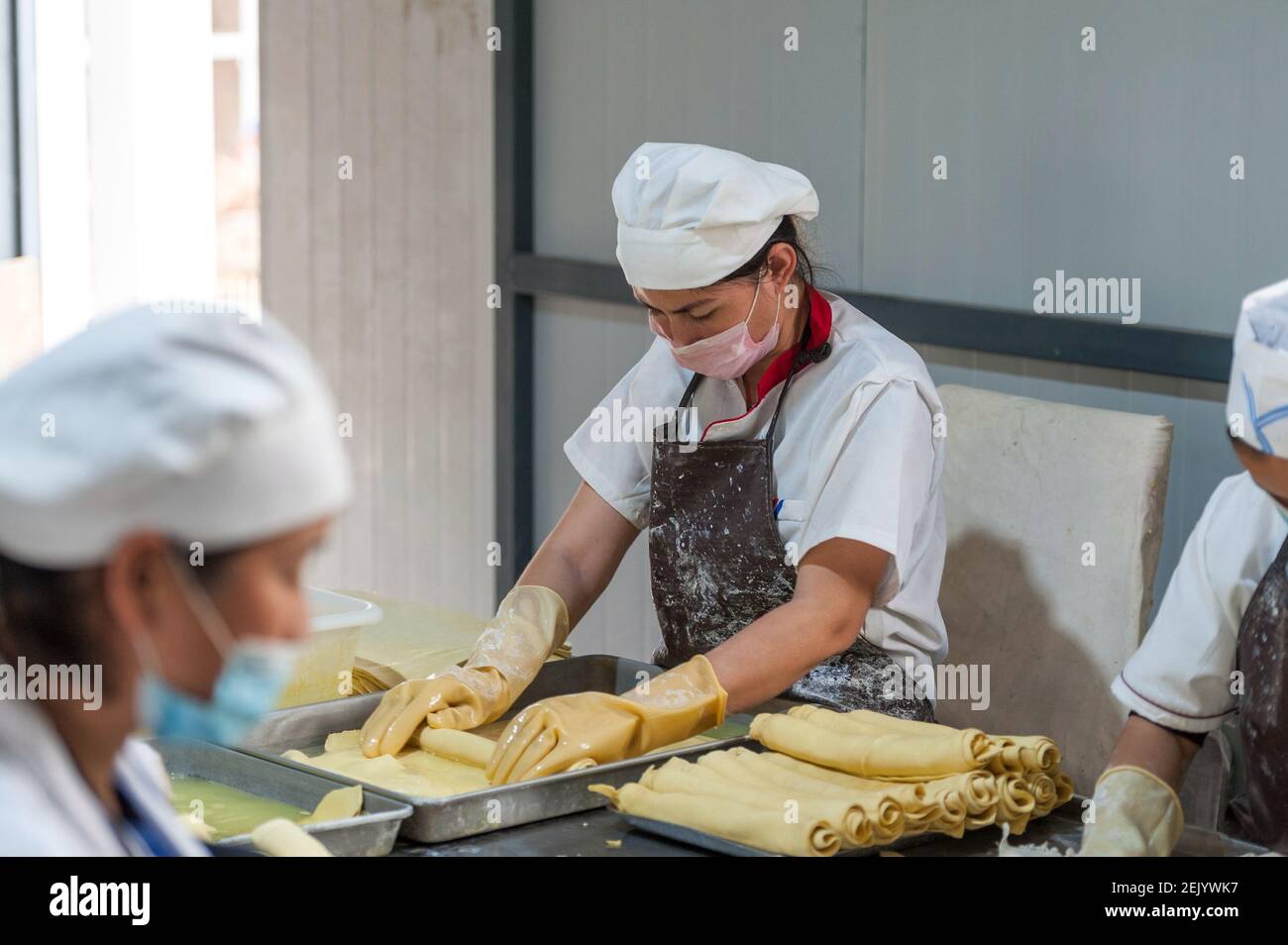 KUQA, CHINA - APRIL 13, 2020 - Workers are busy making plain chicken ...