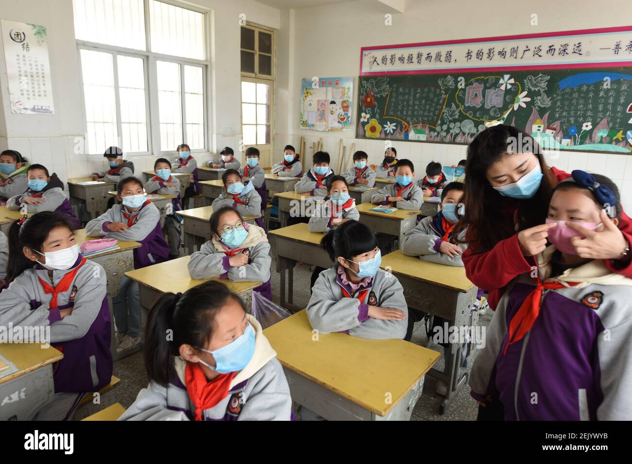 DONGHAI, CHINA - APRIL 14, 2020 - Teachers are guiding students to wear masks correctly, Donghai ...
