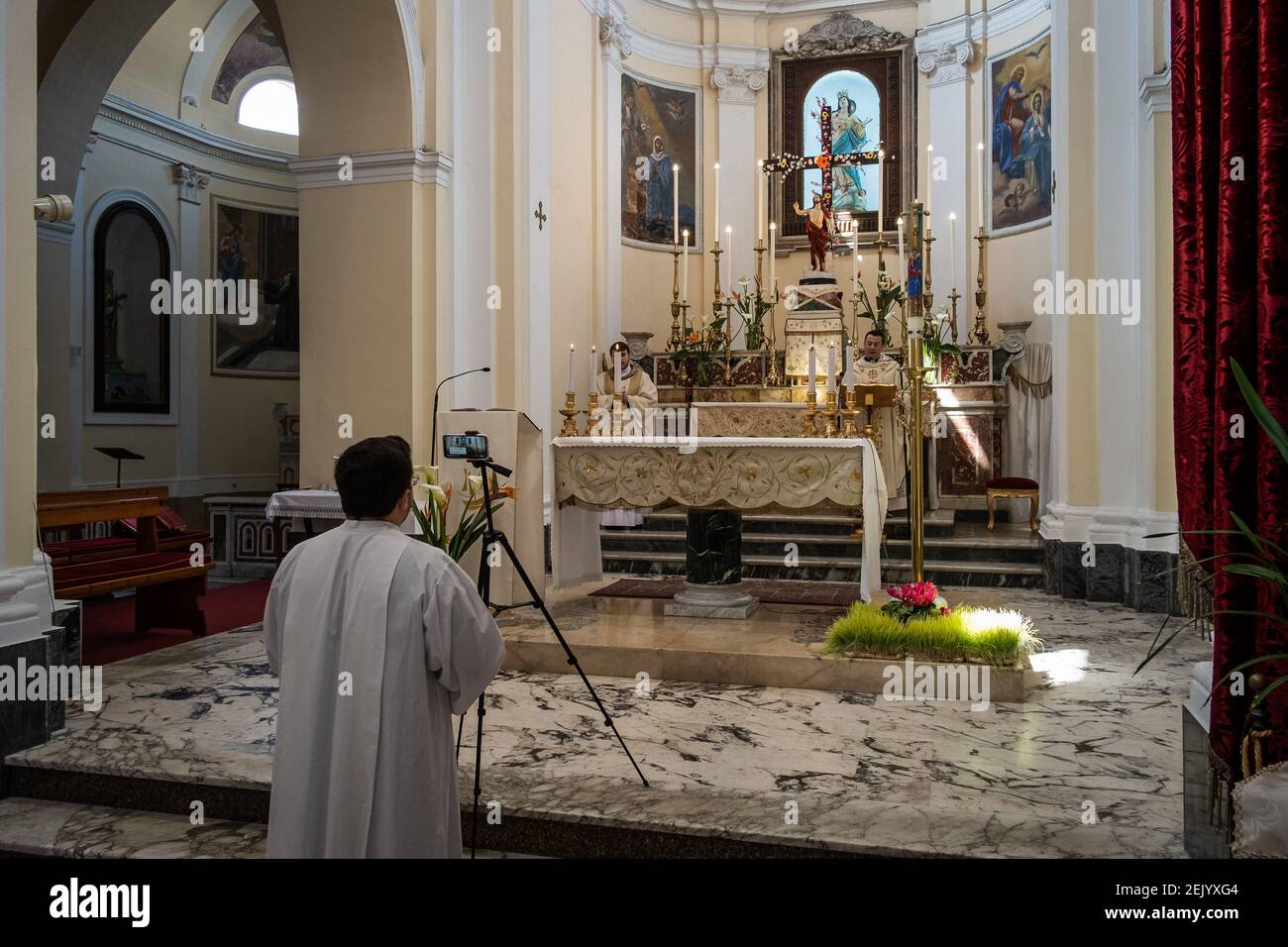 (4/12/2020) A priest leads a Palm Sunday mass, service through live ...