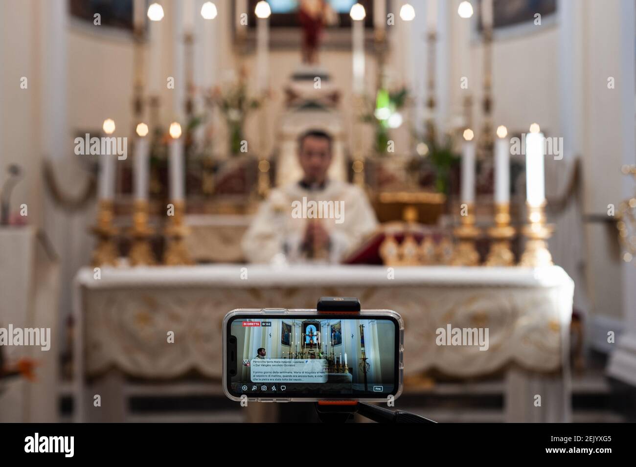 (4/12/2020) A priest leads a Palm Sunday mass, service through live ...