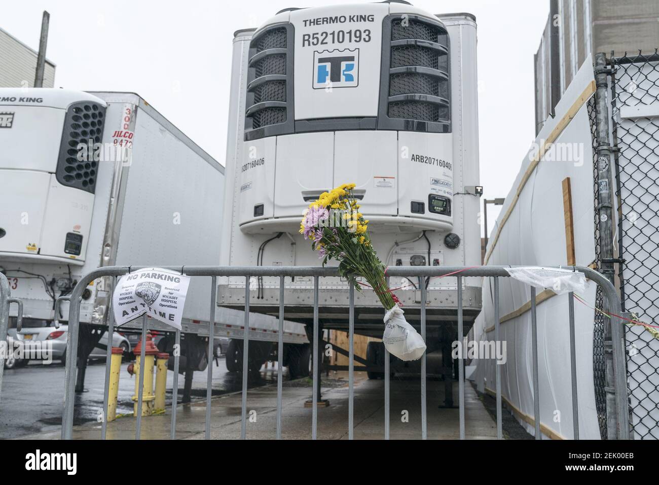 Bouquet of flowers attached to metal rail at refrigerated trailers used ...