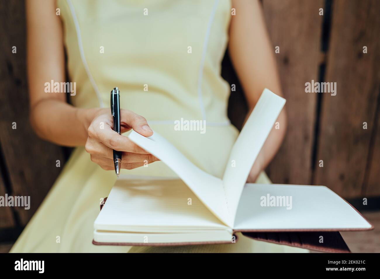 Young woman writing note book hi-res stock photography and images - Alamy