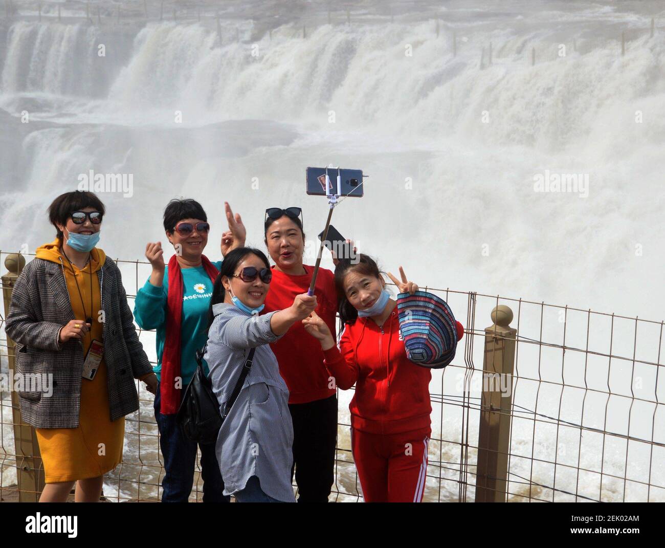 JI, CHINA - APRIL 12, 2020 - Tourists take photos in Hukou Waterfall ...