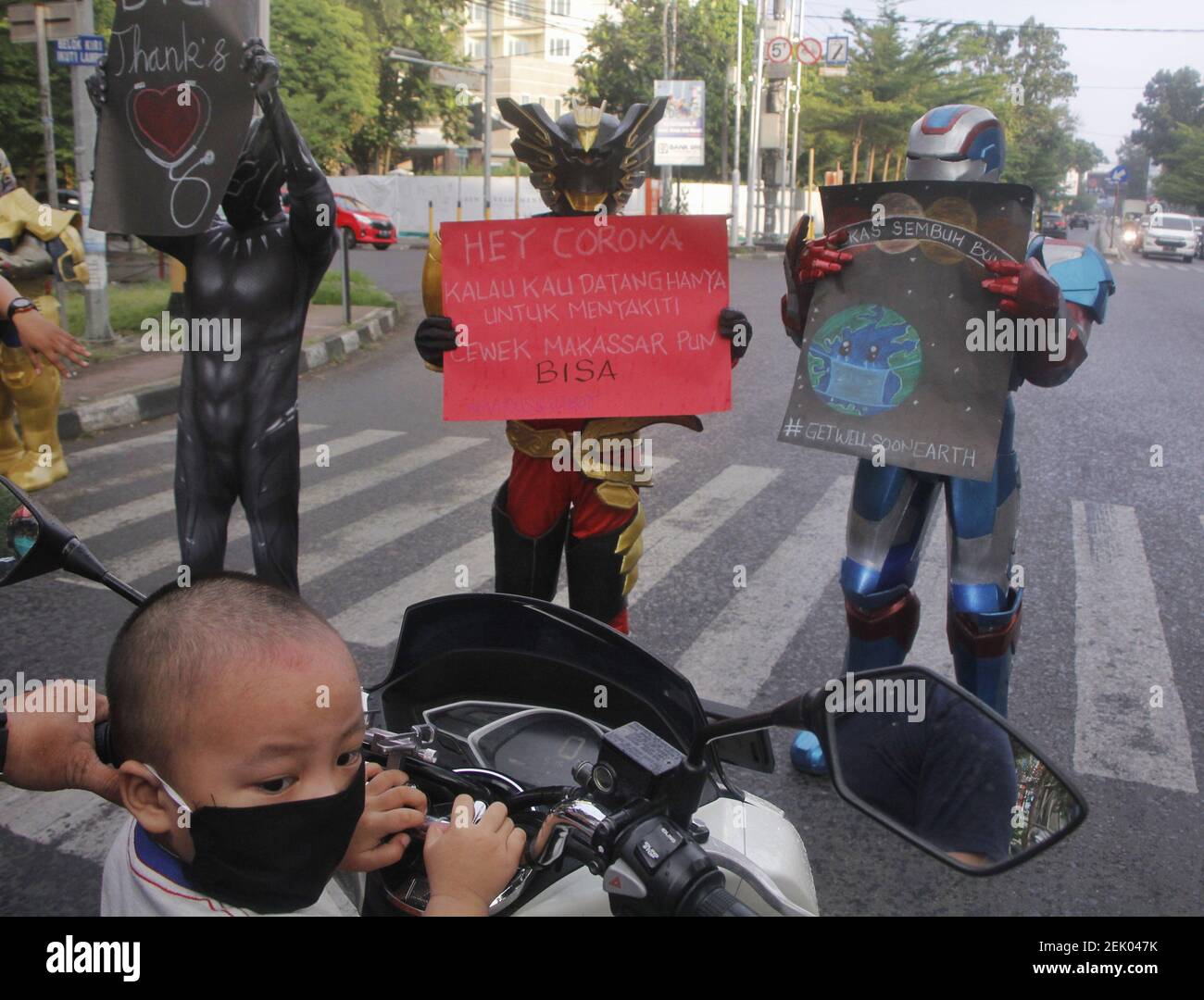 Volunteers wearing a Iron Man, Black Panther, Wolverine, costume during ...