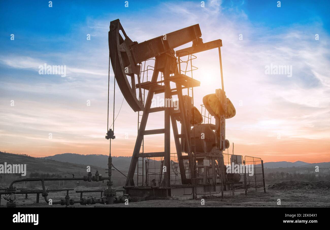 Oil drilling derricks at moutain oilfield for fossil fuels output and ...