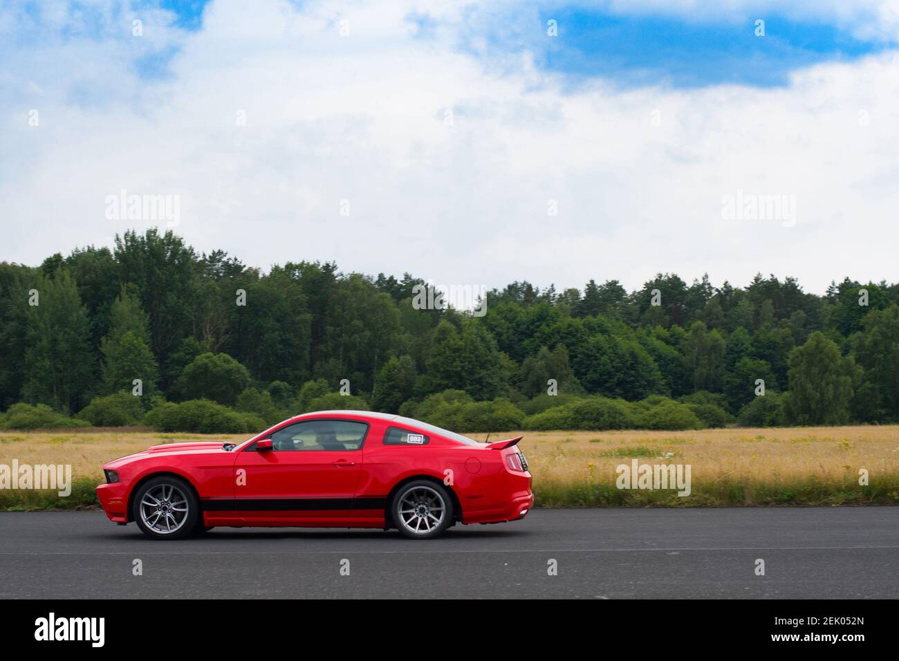 Red car rushing along a high-speed highway Stock Photo - Alamy