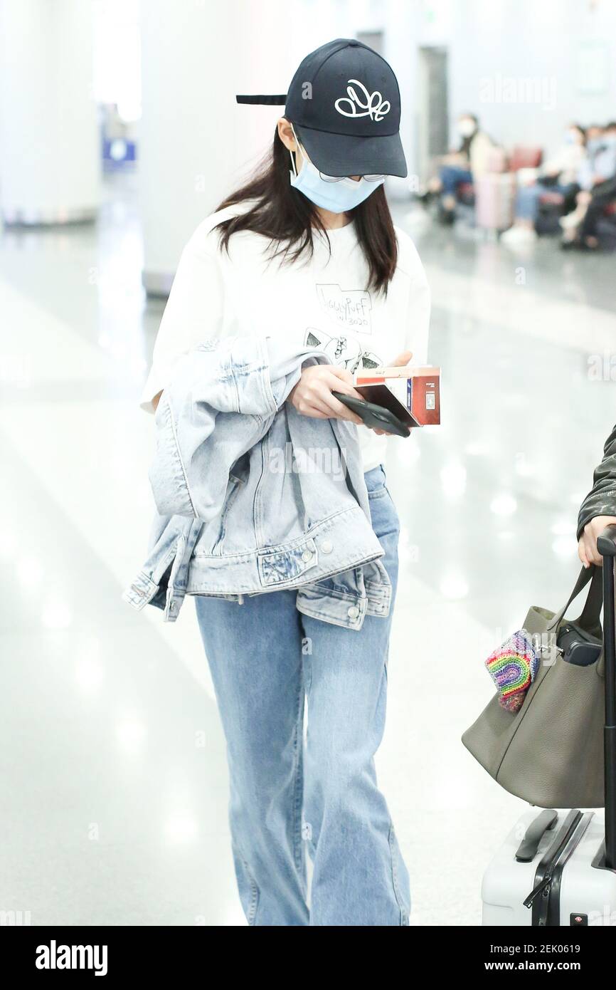Chinese actress Chen Yuqi or Yukee Chen arrives at a Beijing airport before departure in Beijing ...