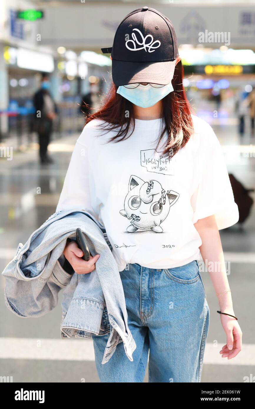 Chinese actress Chen Yuqi or Yukee Chen arrives at a Beijing airport ...