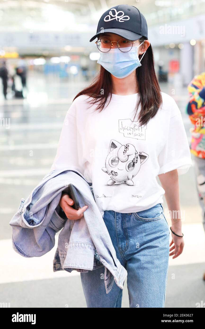 Chinese actress Chen Yuqi or Yukee Chen arrives at a Beijing airport before departure in Beijing ...
