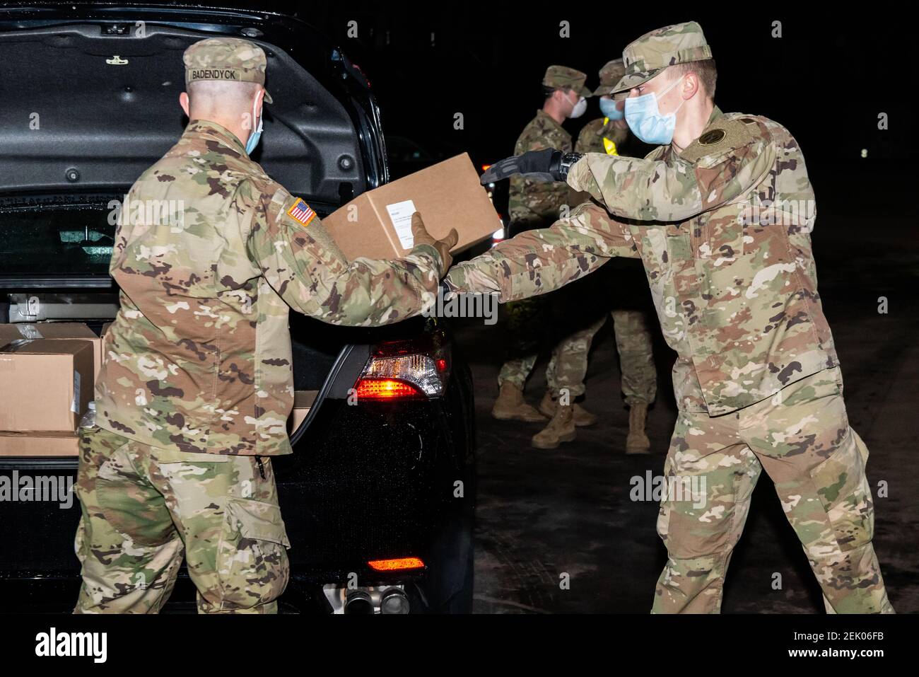 Soldiers of the U.S. Army load meals into the cabs of TLC licensed ...