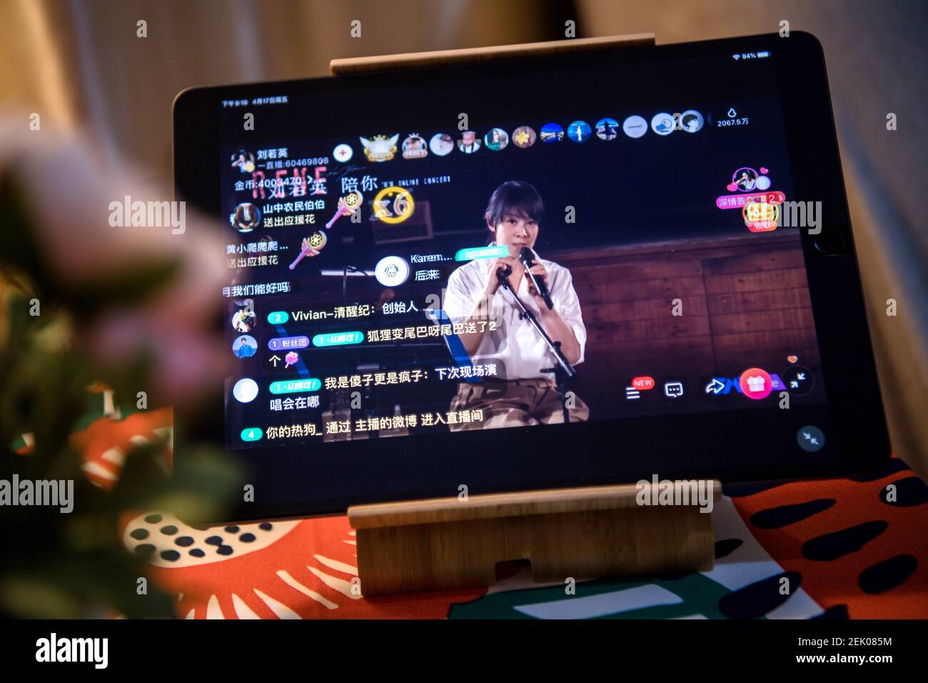In this unlocated photo, a fan watches a livestream concert of Chinese ...