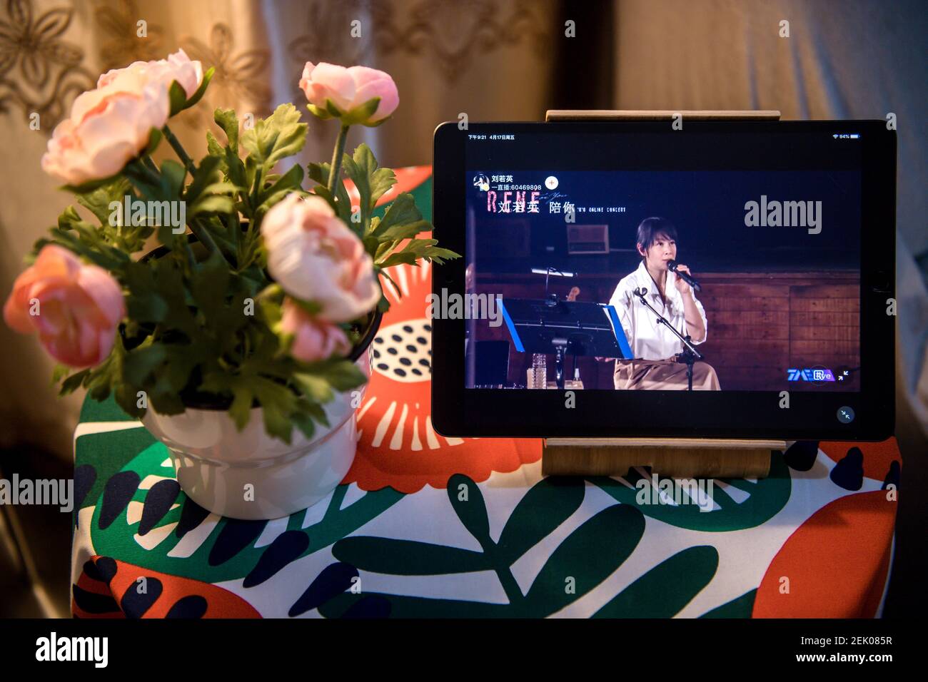 In this unlocated photo, a fan watches a livestream concert of Chinese ...