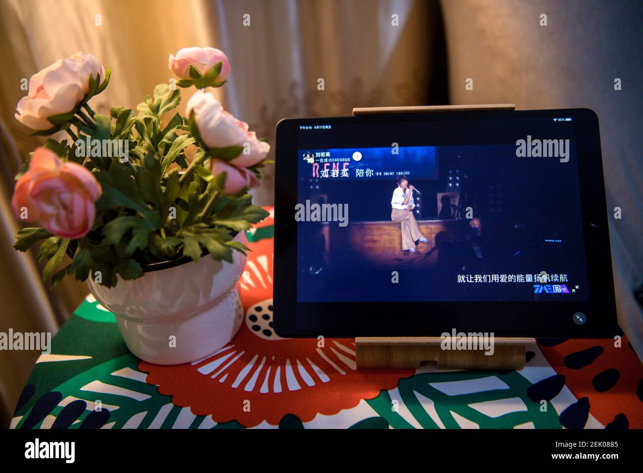 In this unlocated photo, a fan watches a livestream concert of Chinese ...