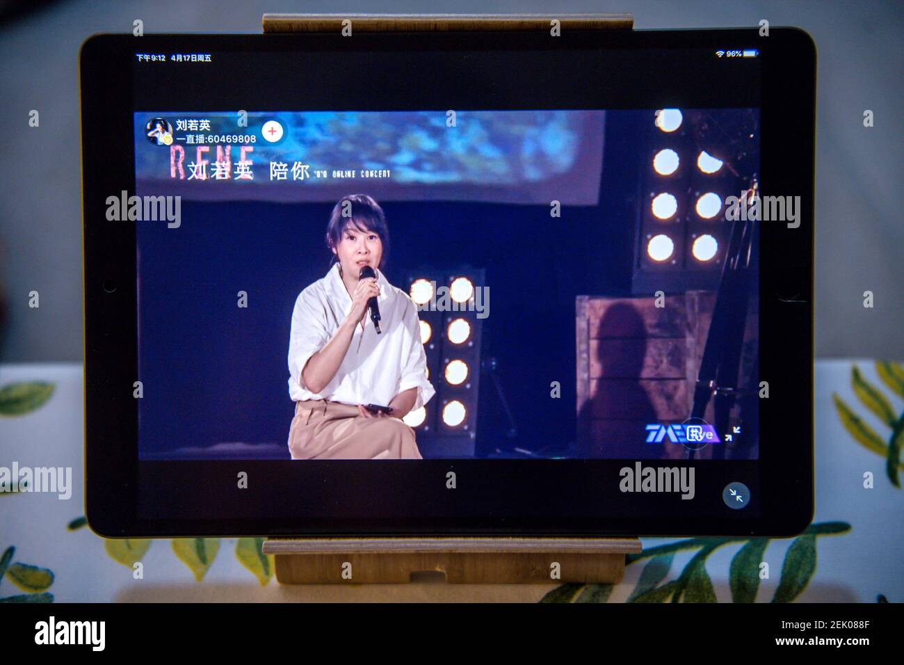 In this unlocated photo, a fan watches a livestream concert of Chinese ...