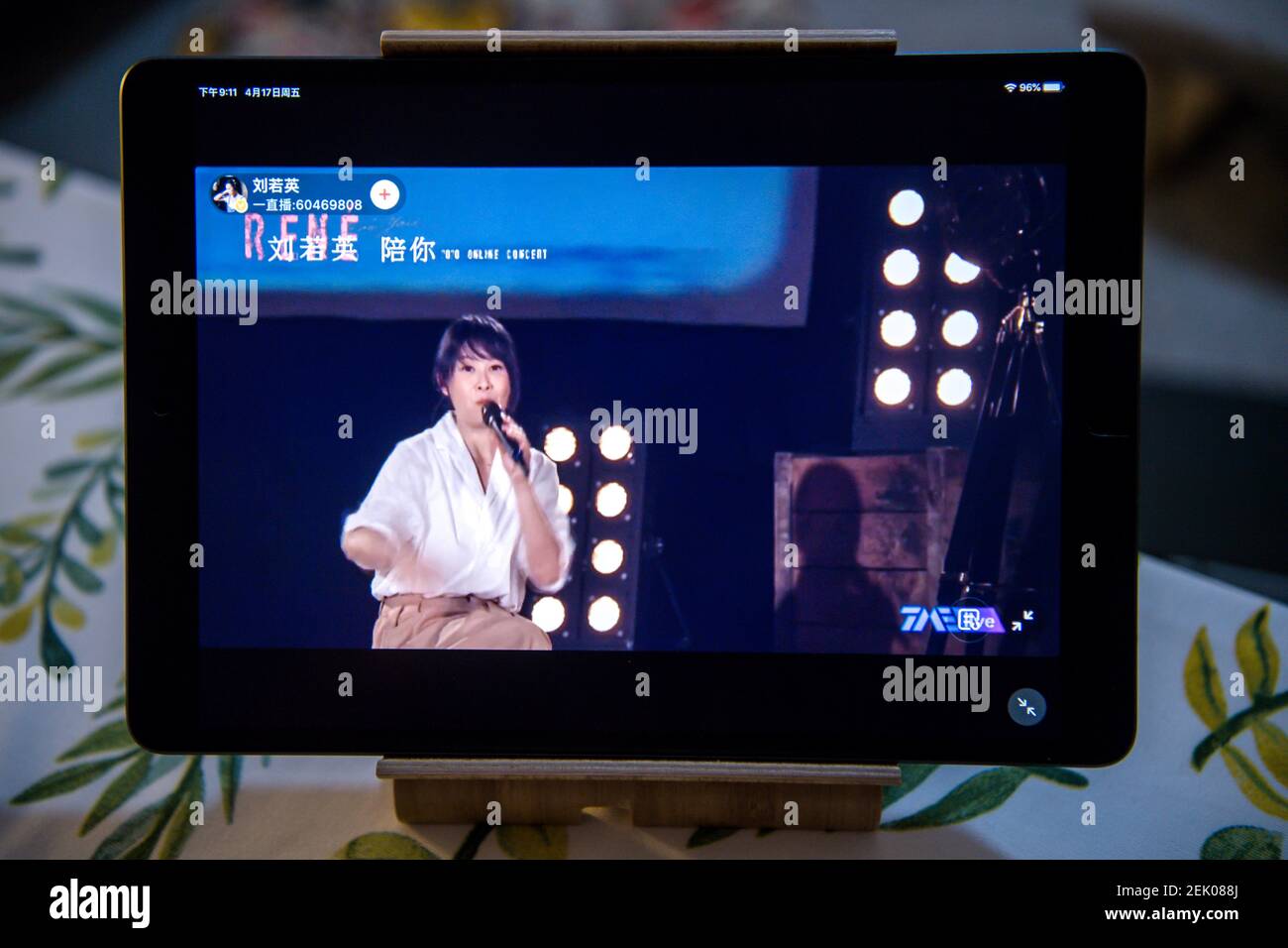 In this unlocated photo, a fan watches a livestream concert of Chinese ...