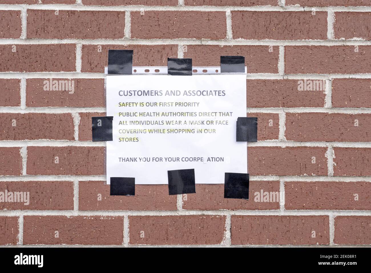 A warning sign is posted outside Rite Aid pharmacy asking customer to ...