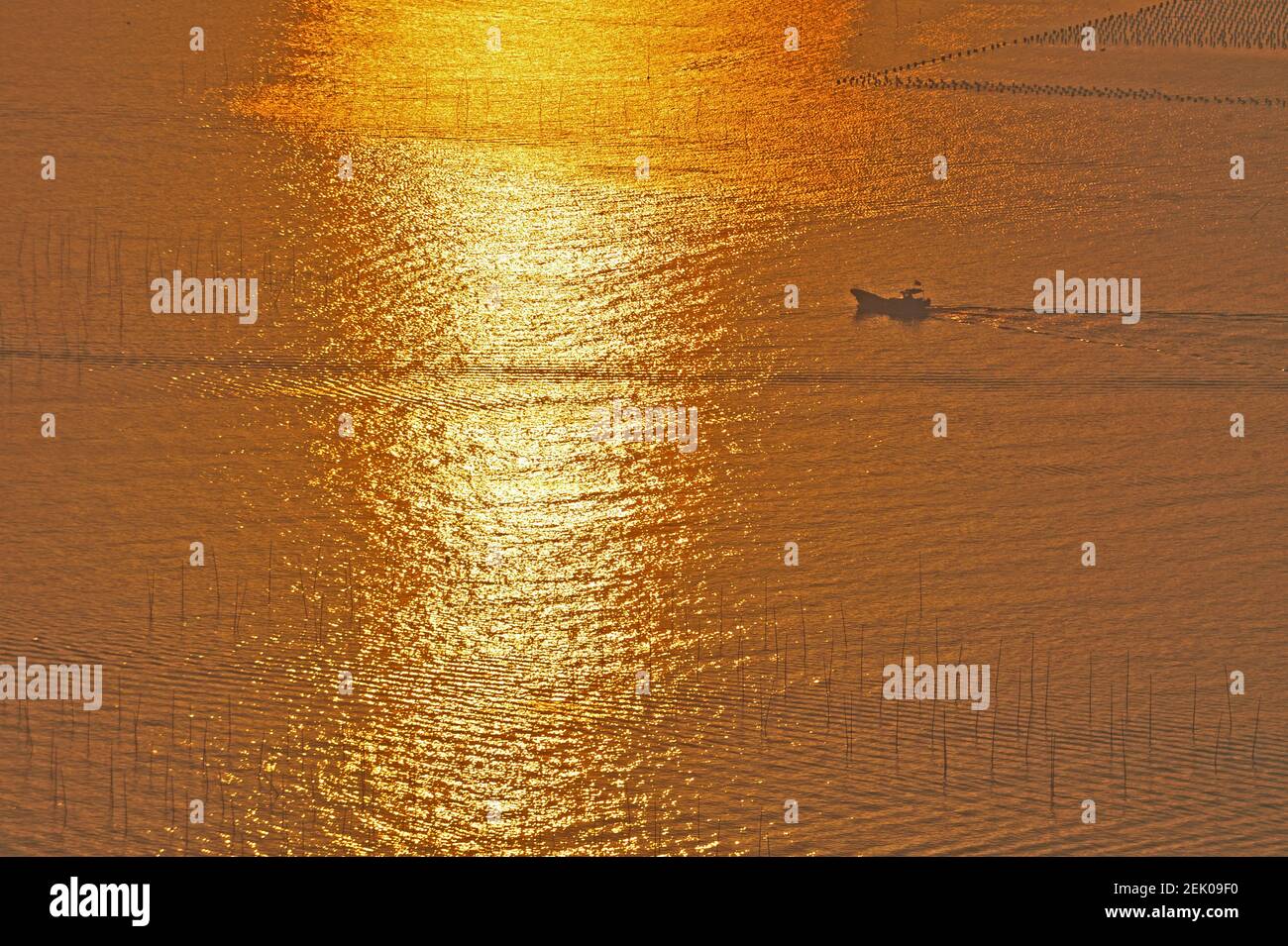 XIAPU, CHINA - APRIL 17, 2020 - A boat on the sea at sunrise, Xiapu ...