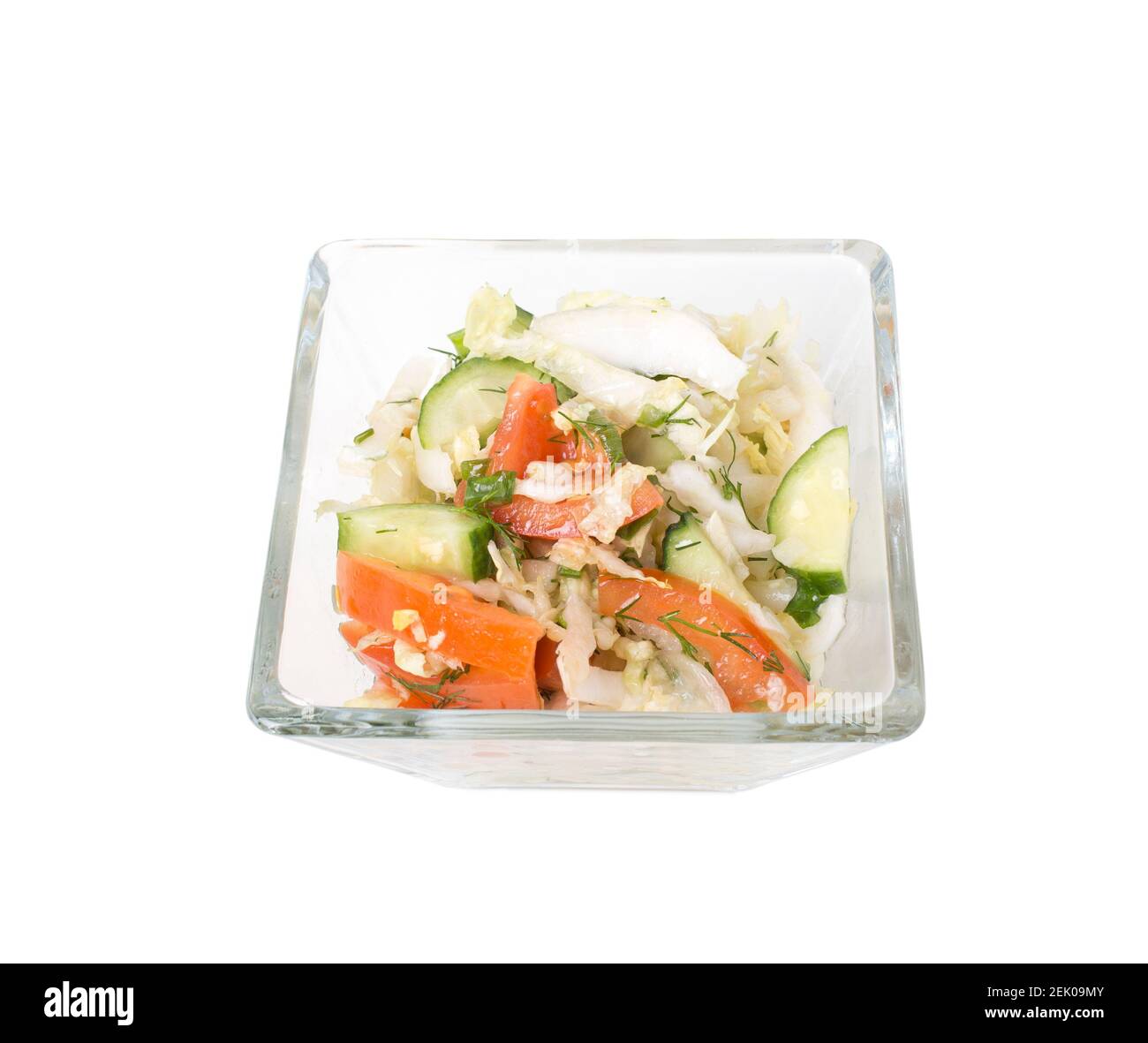 Fresh vegetarian salad in a square glass bowl. Isolated on a white ...